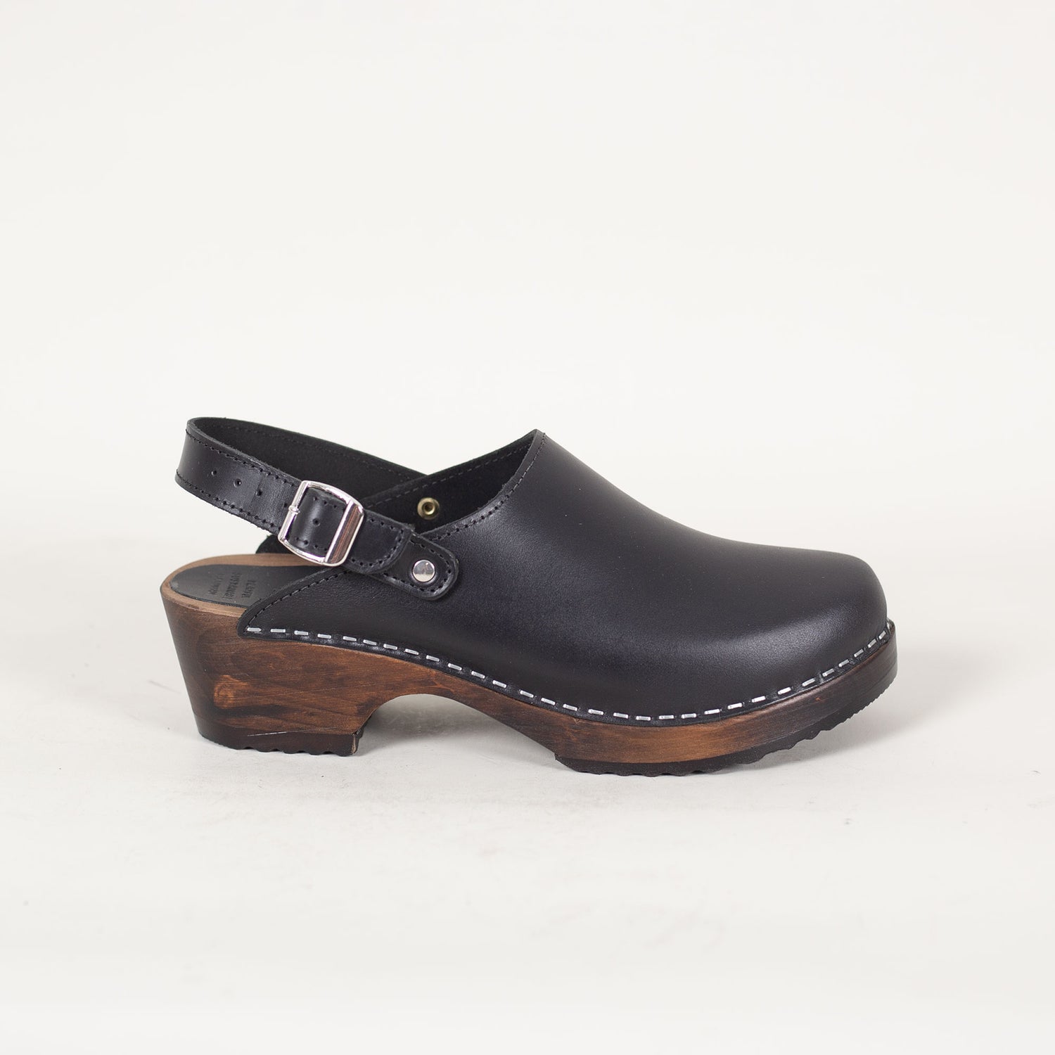 Austin clogs in black leather on brown stained and varnished comfy bottoms